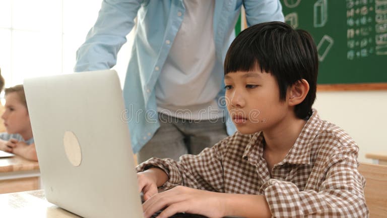 Caucasian Teacher Helping Asian Student Coding Engineering Prompt. Pedagogy. Stock Image - Image ...