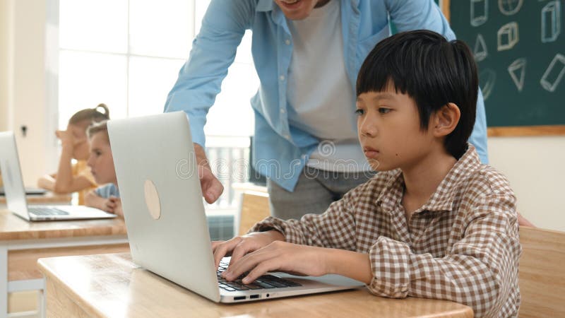 Caucasian Teacher Helping Asian Student Coding Engineering Prompt. Pedagogy. Stock Photo - Image ...