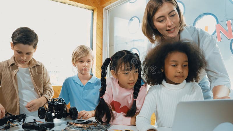 Caucasian Teacher Walking and Check Student Homework at Classroom ...