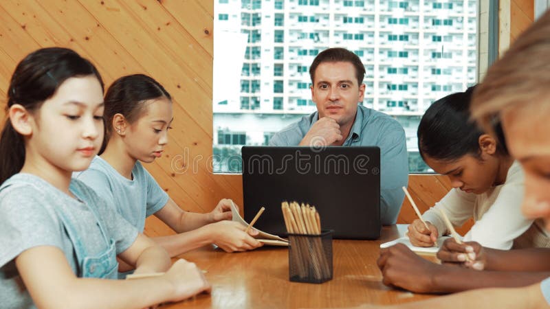 Caucasian Teacher and Smart Boy Discuss about Project at Class ...