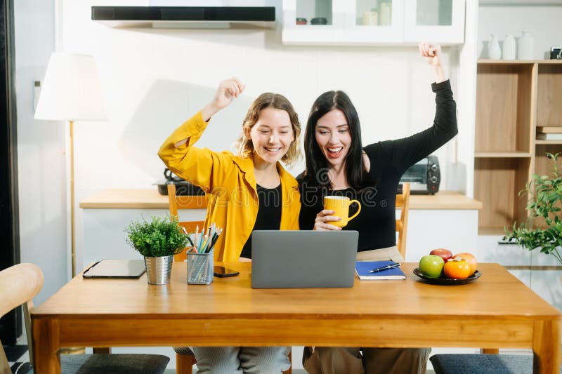Caucasian Teamwork and Creativity with Sitting Working at Kitchen Table ...