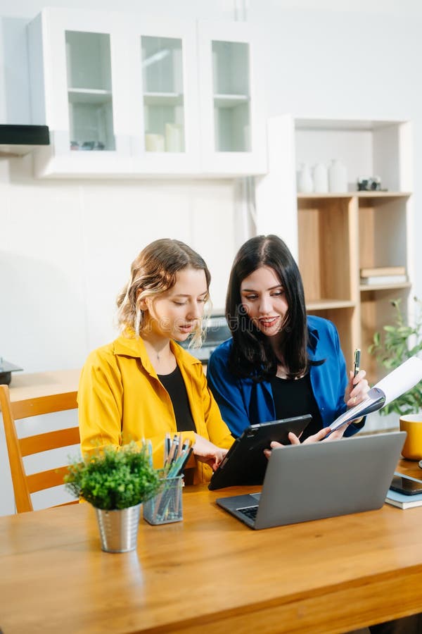 Caucasian Teamwork and Creativity with Sitting Working at Kitchen Table ...