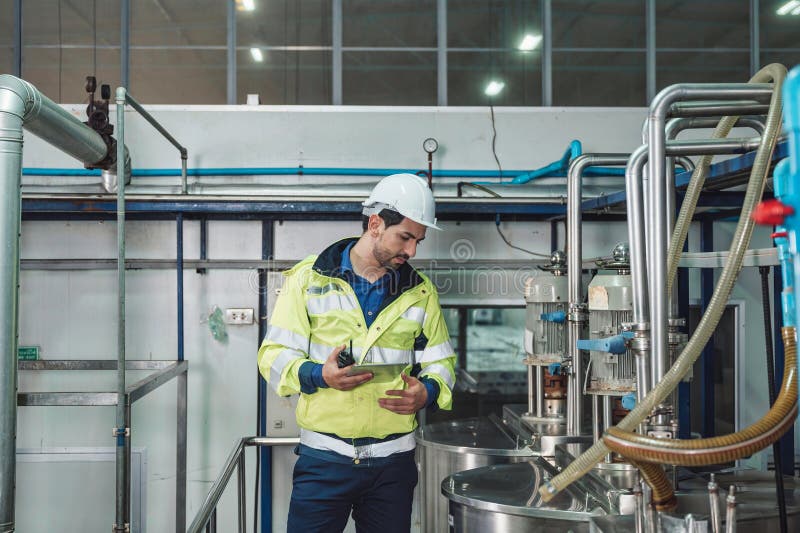Engineer Man in Uniform Walking To Check Boiler Tanks with Liquid ...