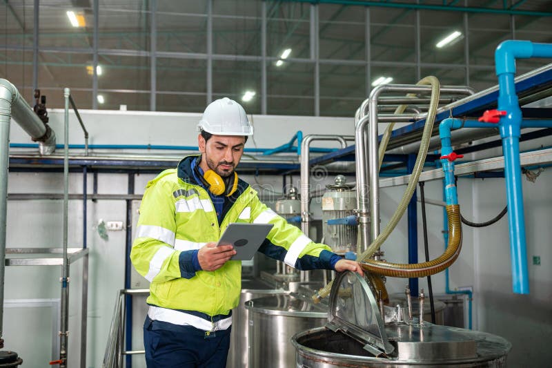 Caucasian Technician Engineer Man in Uniform with Tablet Checking and ...