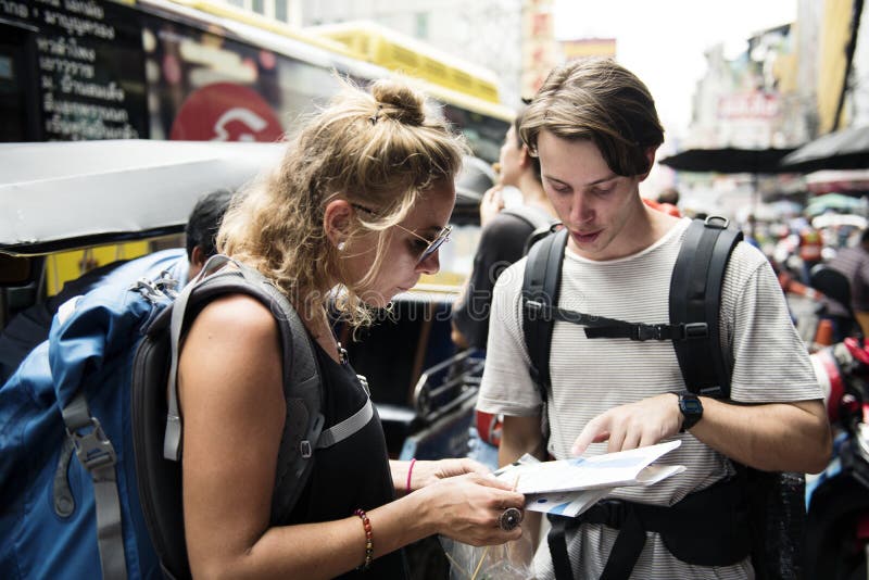 Tourists Checking Information on Line at Sunset Stock Photo - Image of ...