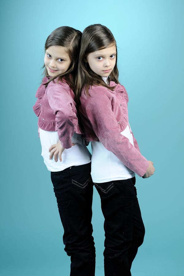 Caucasian Twins Posing in Studio Stock Photo - Image of black, models ...