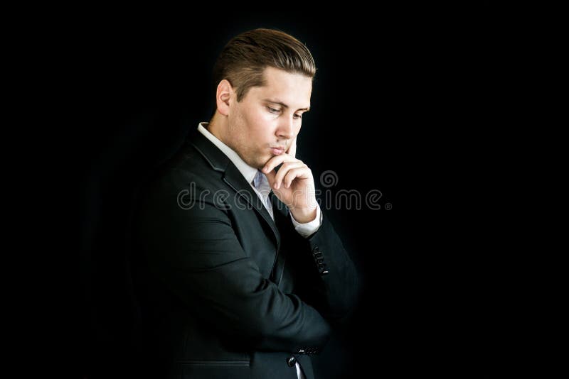 Man Posing in a Studio, Serious Thinking Stock Image - Image of sitting ...