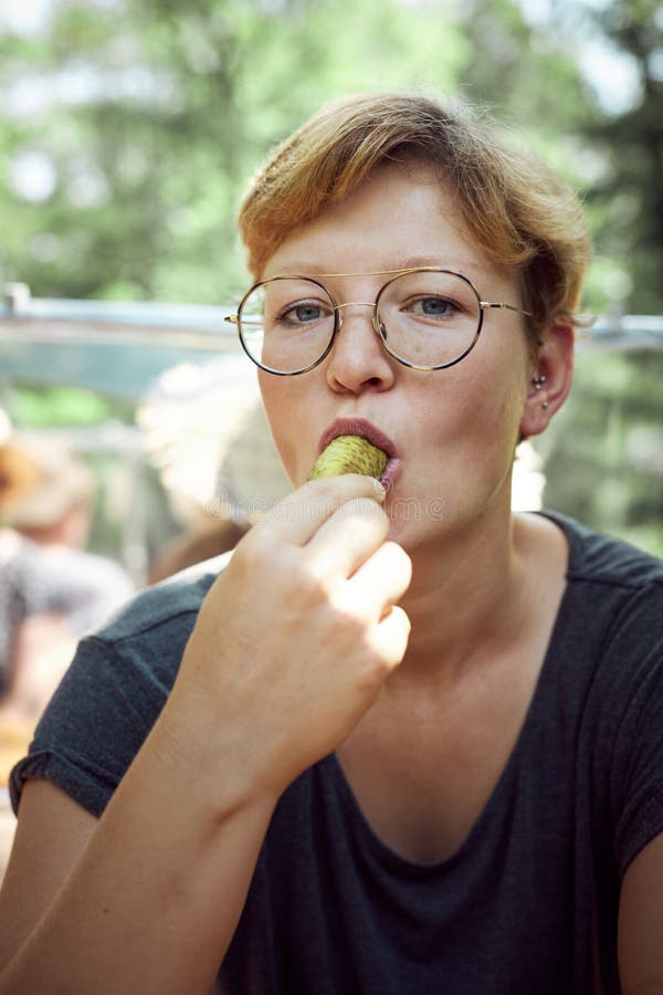 Caucasian Woman Eating Pickle Stock Image - Image of girl, happy: 261568681