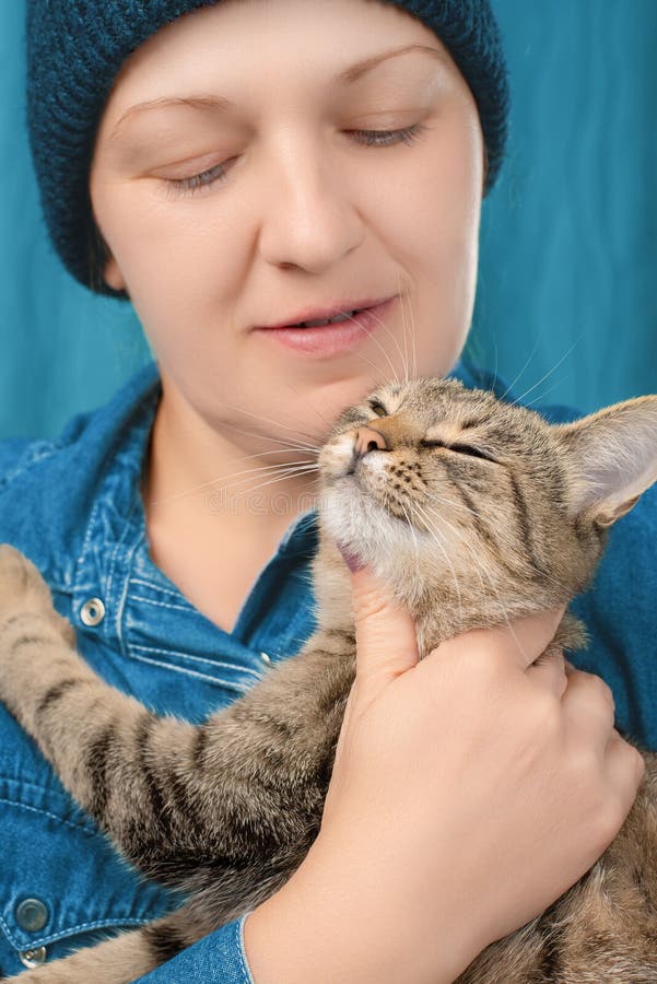 Caucasian Woman Hugs and Strokes a Tabby Cat. Front View Stock Photo ...
