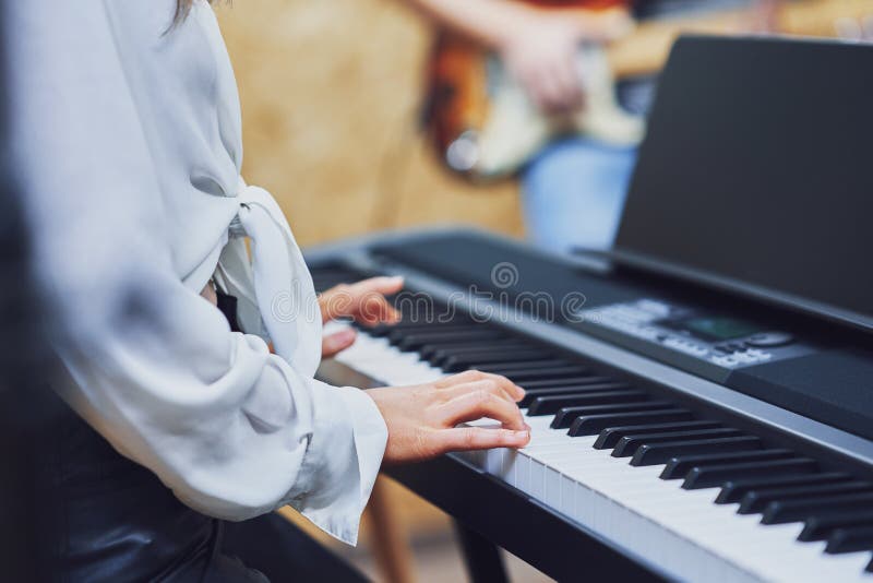 Caucasian Woman Playing on Keyboard with Band Stock Image - Image of ...