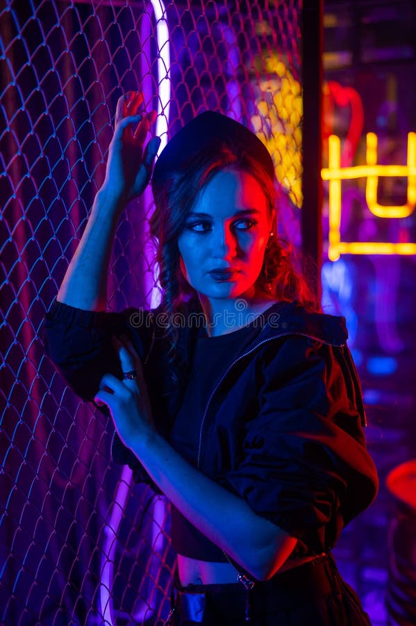 Caucasian Woman Posing in Neon Studio. Stock Image - Image of glitter ...