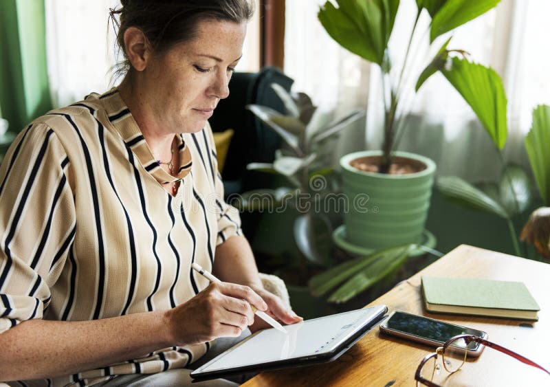 Caucasian Woman Writing To Do List on Tablet Stock Photo - Image of ...