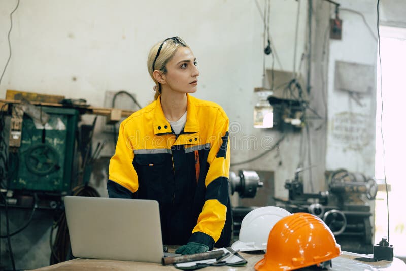 Caucasian Women Engineer Worker Working at Design Desk Working in Heavy ...