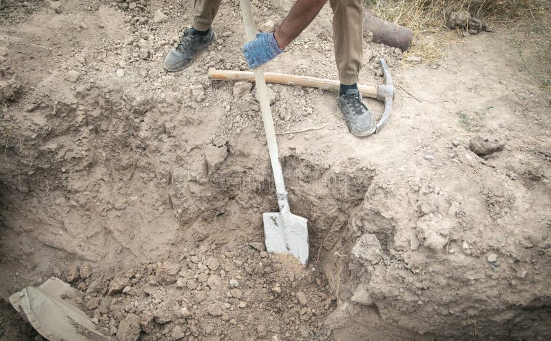 Caucasian Worker Digging a Hole Stock Image - Image of work, outdoors ...
