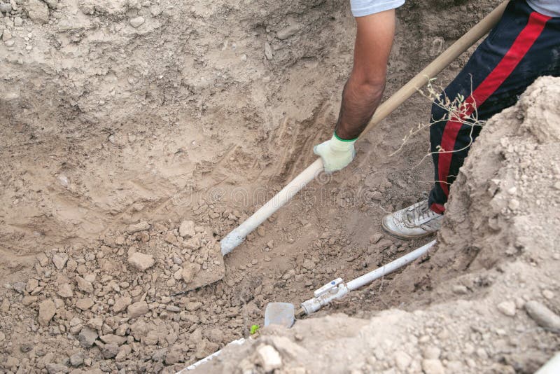 Caucasian Worker Digging a Hole Stock Photo - Image of industry ...