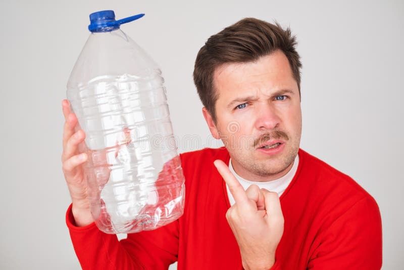 Caucasian Man Holding Empty Plastic Bottle. Problem with Frinking Pure ...
