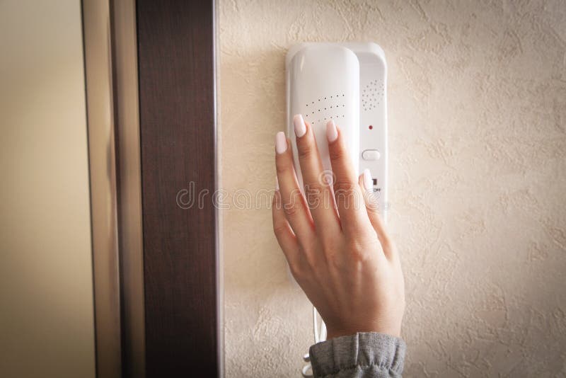 Caucasian Young Woman Holding Intercom Receiver Stock Photo - Image of ...