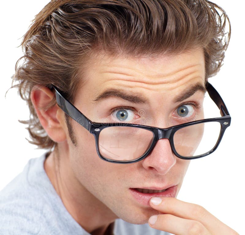 Caught in the Act...Young Man Looking Worried and Touching His Lip ...