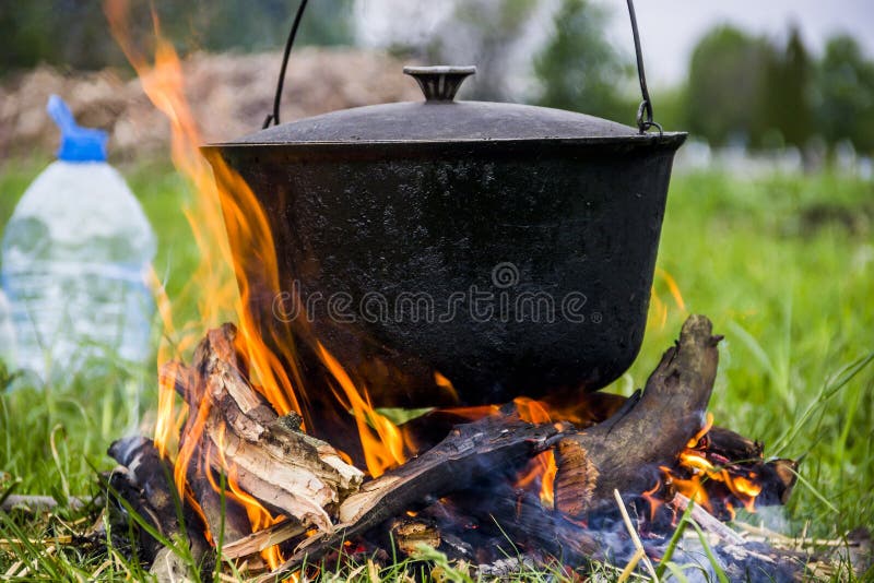 Cauldron on a campfire stock image. Image of boiling - 10673393