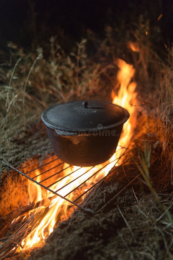 Cauldron on fire at night stock photo. Image of travel - 100484236