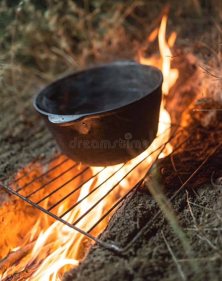 Cauldron on fire at night stock photo. Image of travel - 100484236