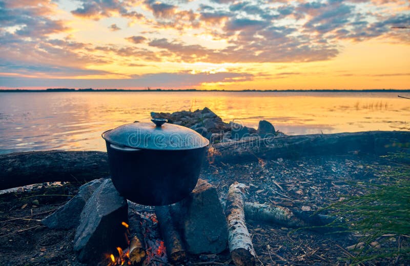 Dawn by the Water. Cooking Over a Campfire Stock Image - Image of ...