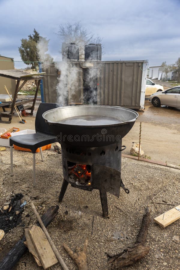 A Cauldron of Water Boiling Over an Open Flame Stock Photo - Image of ...