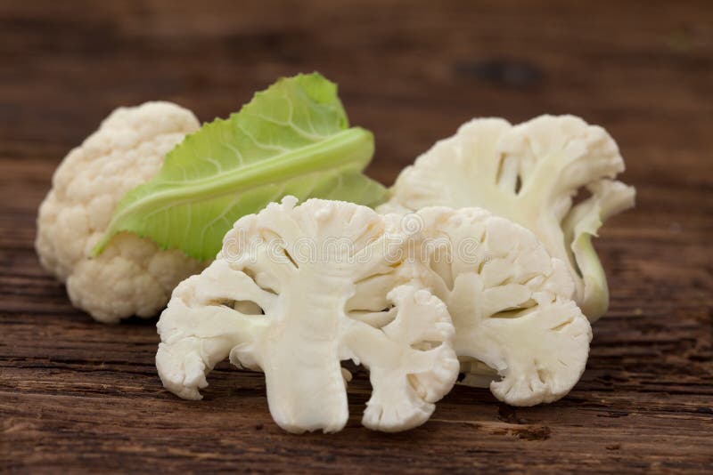 Cauliflower Pieces on a Rustic Table Stock Image - Image of piece ...