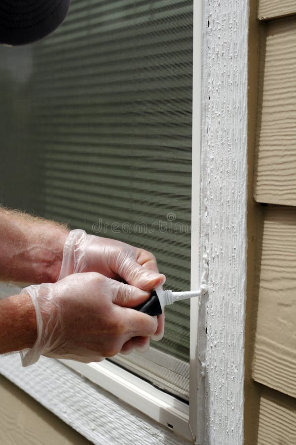 Caulking Holes in Window Frame Stock Photo - Image of caucasian, home ...