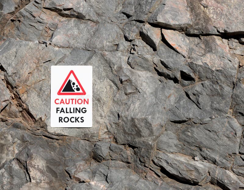 CAUTION FALLING ROCKS sign stock image. Image of stone - 202630823