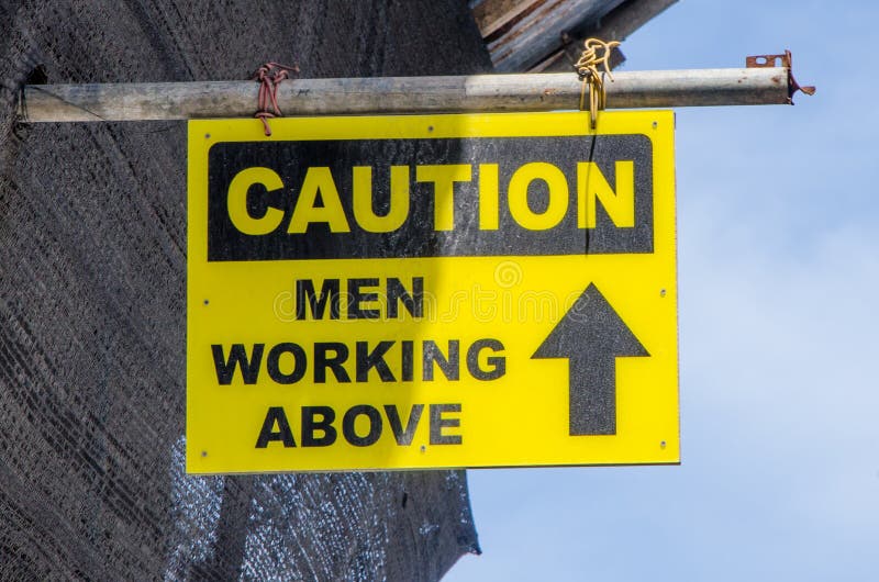Men working above sign stock photo. Image of dangerous - 10442562