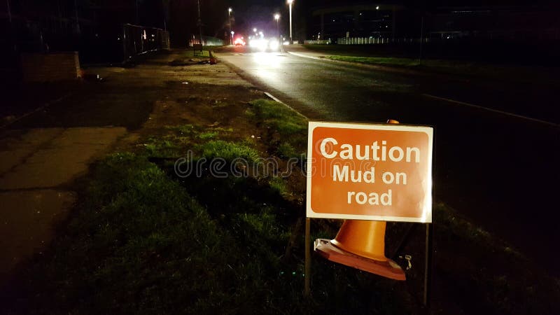 Caution Mud on Road sign stock image. Image of night - 83658033