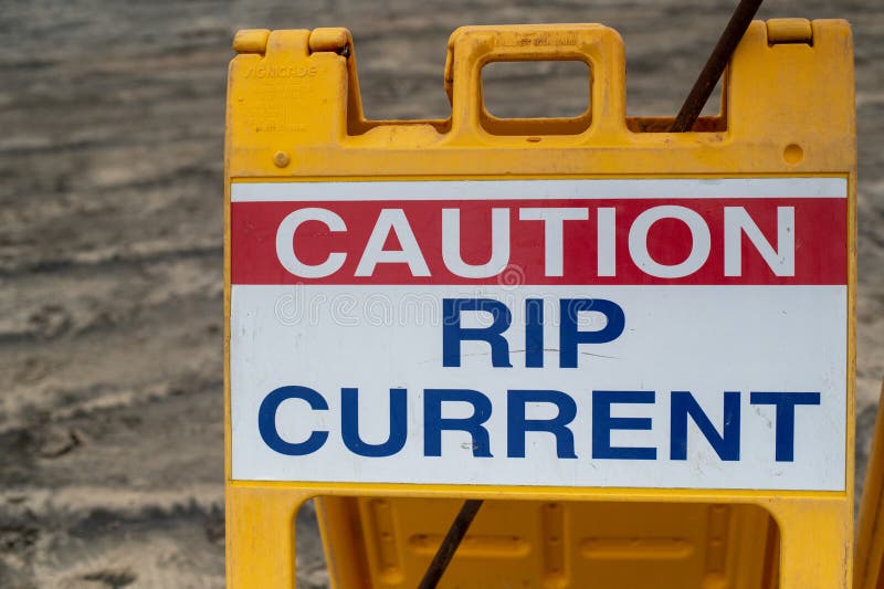 Caution Rip Current Sign on a Beach Stock Image - Image of beach ...
