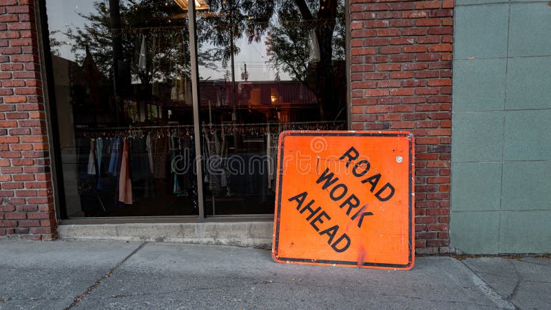Road Work Sign Leaning Against a Building Stock Image - Image of idaho ...