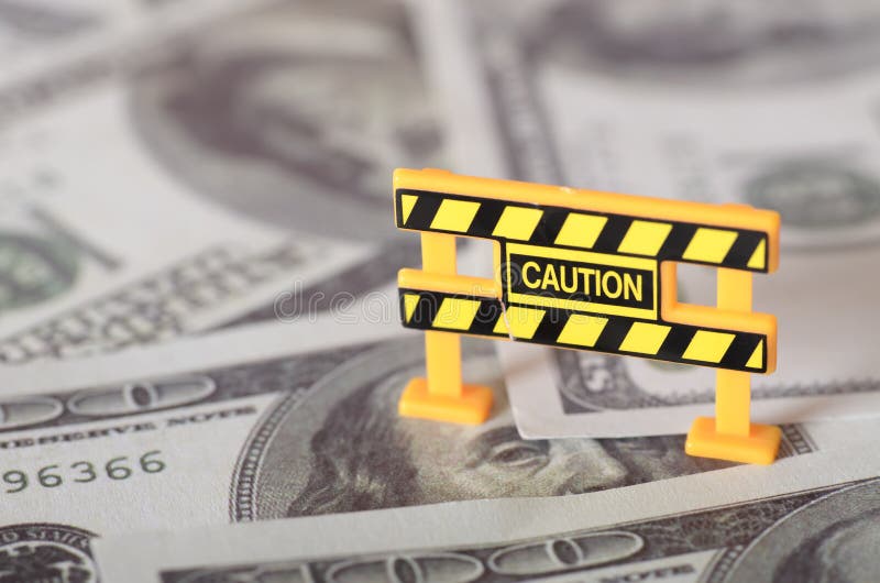 Caution Sign on US Dollar Bills: Warning Symbol for Financial Risk and ...