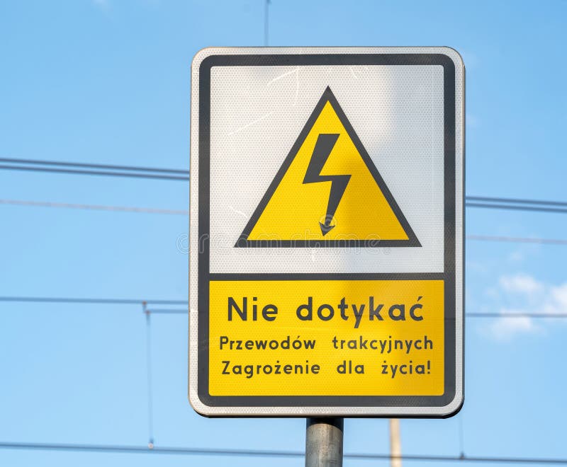 Caution Sign with a Warning Message in Polish Against Touching Overhead ...
