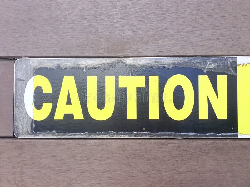 Caution Signage in Yellow Text Stock Photo - Image of warns, closeup ...