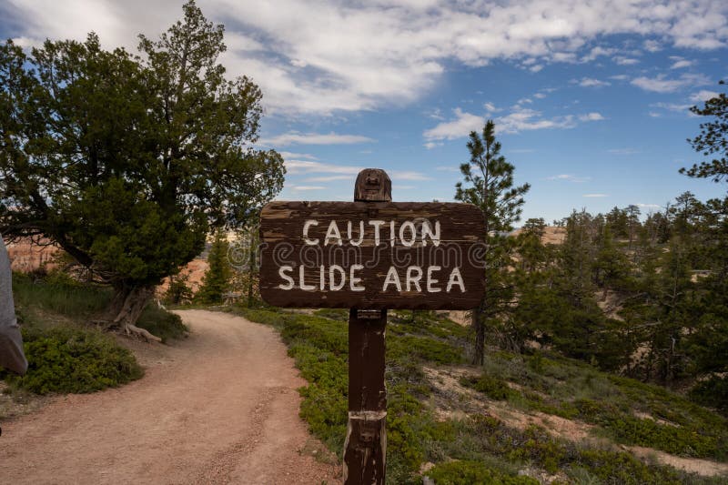 Caution Slide Area Sign in Bryce Stock Photo - Image of orange, cliff ...