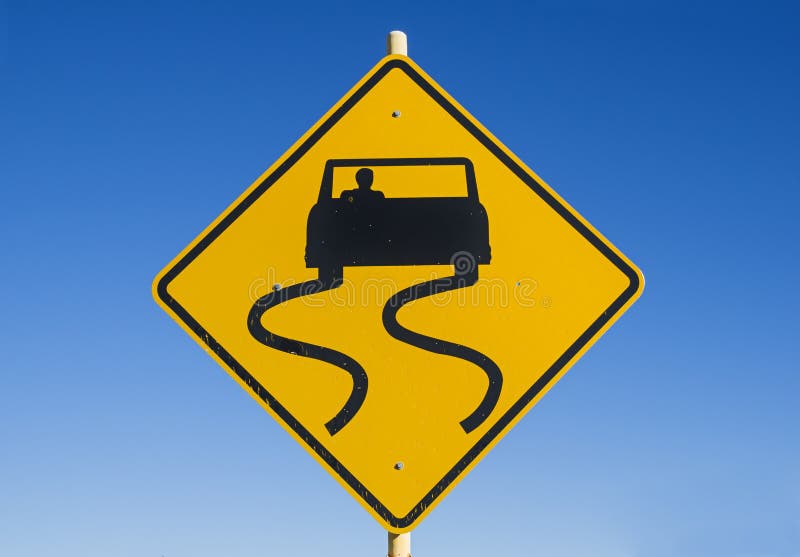 Caution Slippery Road Sign stock photo. Image of marks - 47376830