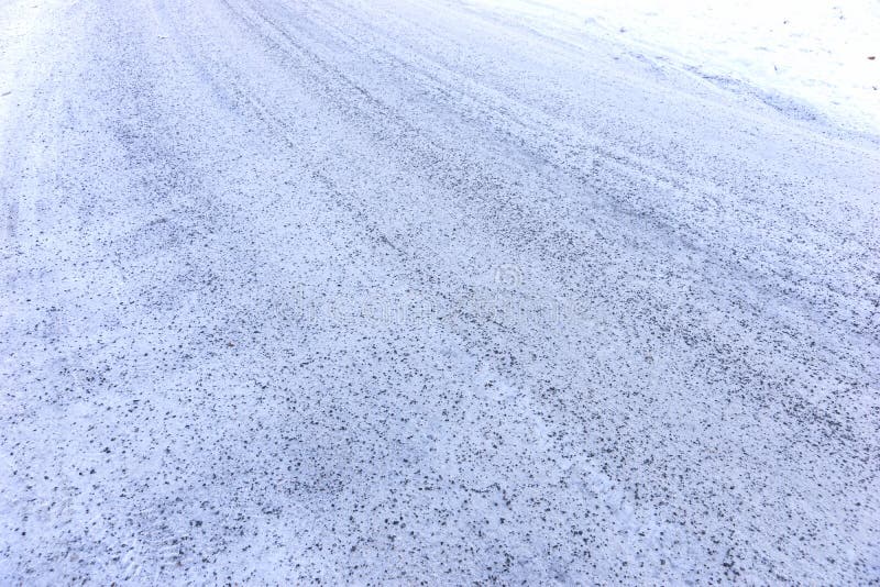 Caution Slippery! Snow with Small Pebbles on the Road Stock Photo ...