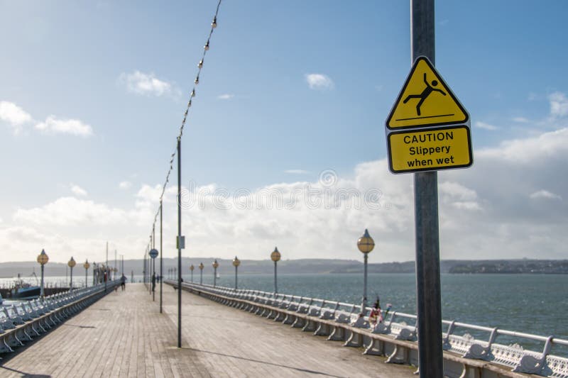 Caution Slippery when Wet Sign. Health and Safety Stock Photo - Image ... Caution Slippery when Wet Sign. Health and Safety Stock Photo - Image ...