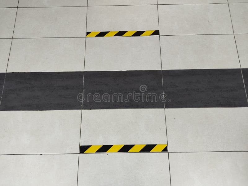 Caution Sticker on the Floor for Social Distancing Practice. Stock ...