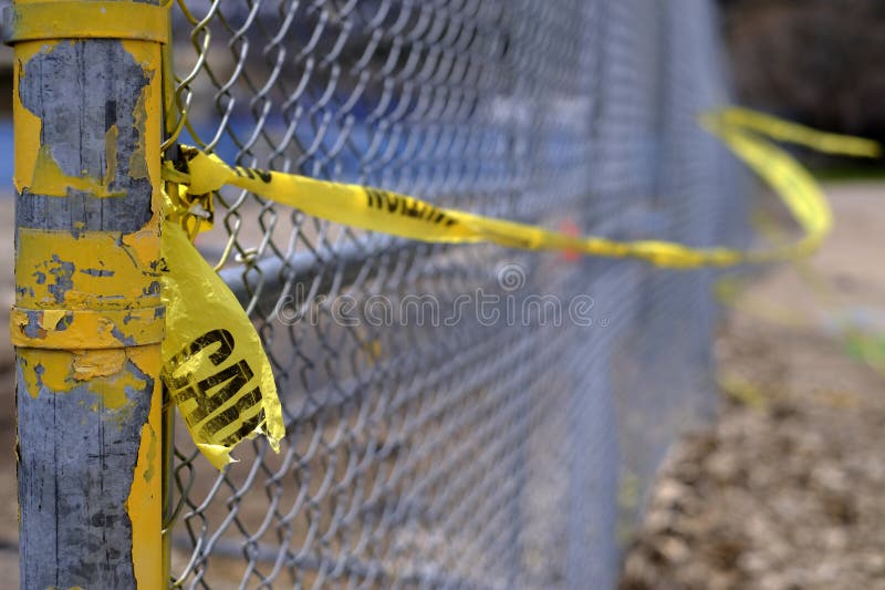 Caution Tape on Fence for Safety and Security Stock Photo - Image of ...