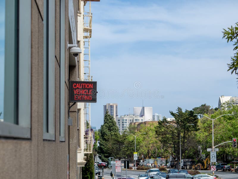 Caution Vehicle Exiting Illuminated Sign Outside of Underground Parking ...