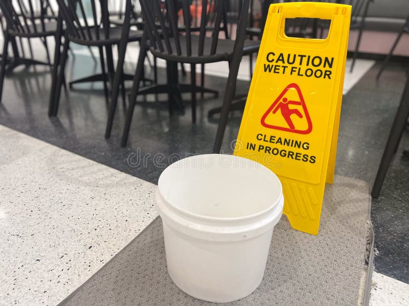 Caution Wet Floor Cleaning in Progress Sign Stock Photo - Image of ...