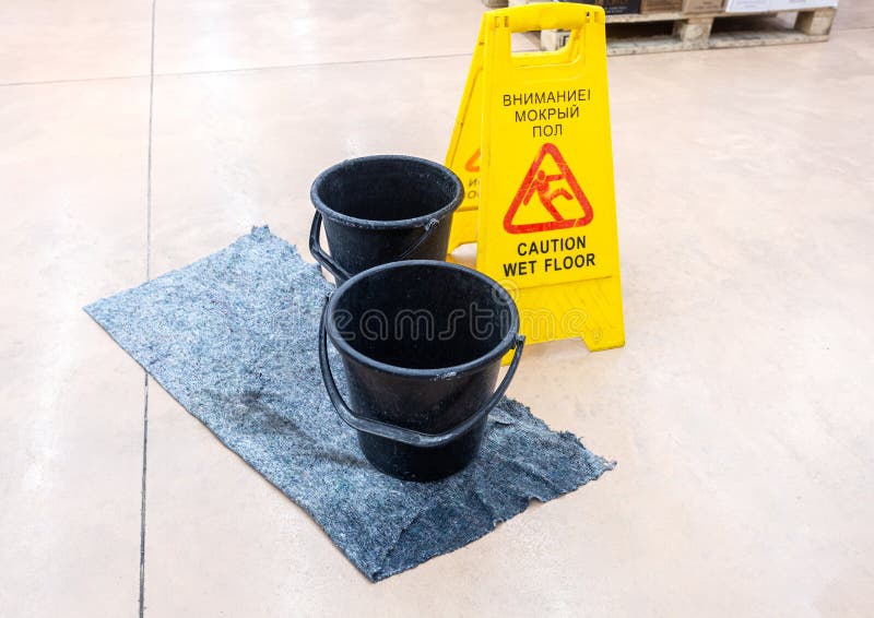 Caution Wet Floor Warning Sign on a Tile Floor in a Superstore Stock ...