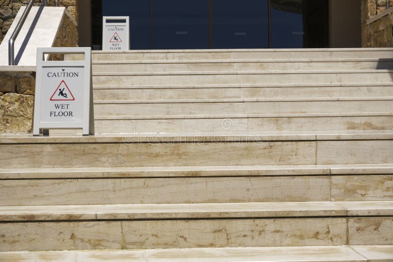 Caution Wet Floor Warning Signs on Stairs. Stock Image - Image of ...