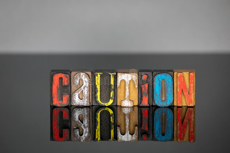 Caution Word from Colored Wooden Letters Stock Photo - Image of caution ...