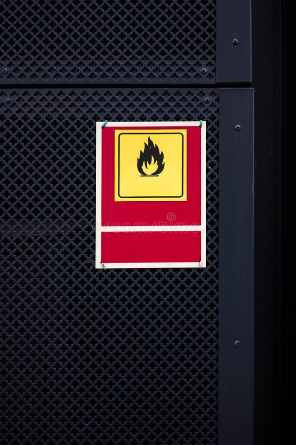 Cautionary Fire Warning Sign on a Black Metallic Grill Stock Image ...