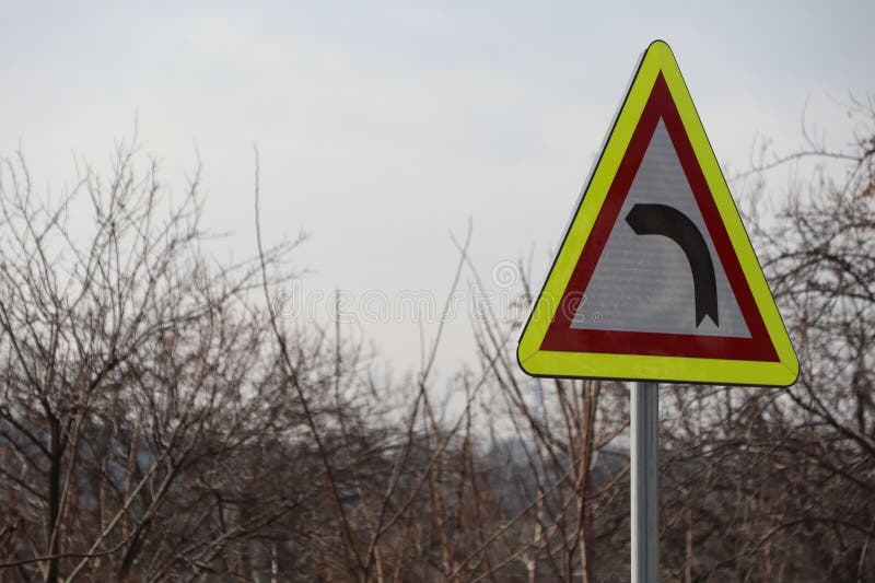 Alert Warning Sign Indicating a Sharp Bend Ahead on a Long and Twisting ...